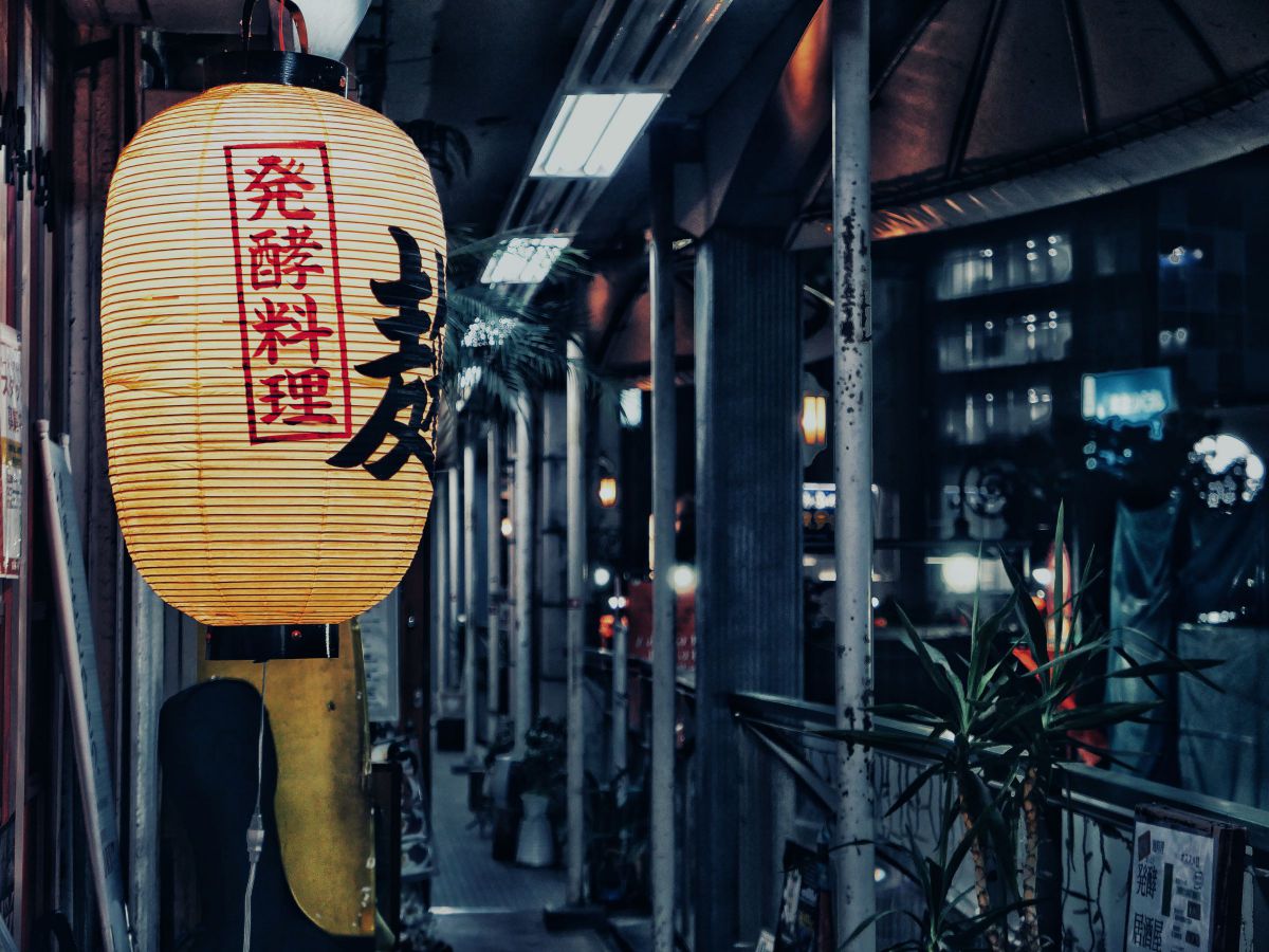 Lantern lighting up a small town. | GANREF