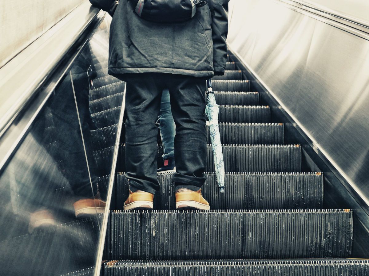 A father and a son on the escalator. | GANREF